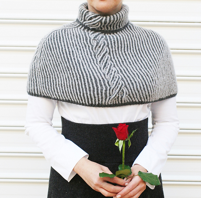 Ravelry: gray reversible cabled capelet pattern by Evelyn Siatra