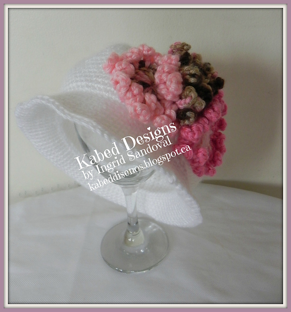 Ravelry: Summer Blossoms Hat pattern by Ingrid Sandoval