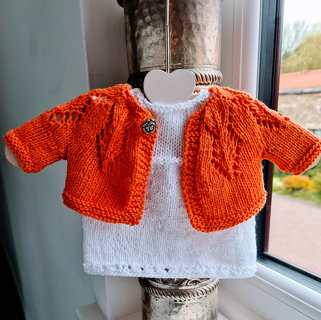Ravelry: 12 Inch Baby Doll Cardigan pattern by Jane Terzza