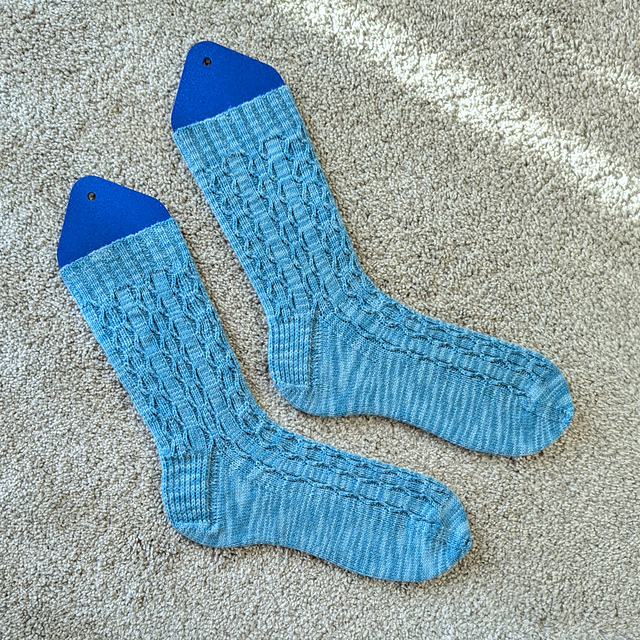Ravelry: Sapphire Martini Socks pattern by KnittingPirate