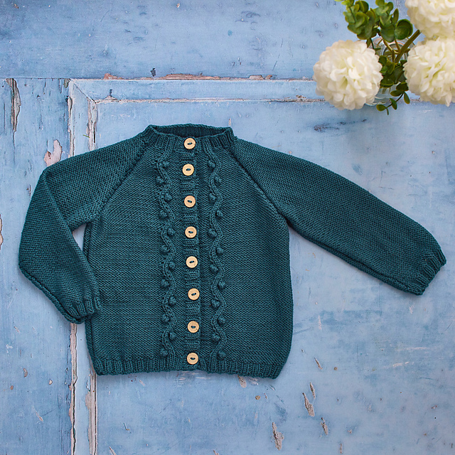 Ravelry: Bobble & Cable Baby Cardigan pattern by Aine Marriott