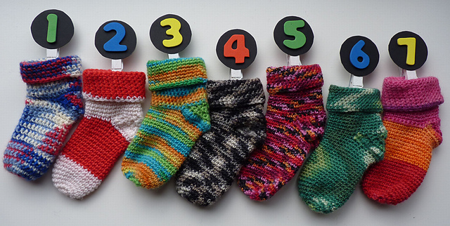 Ravelry: Advent Baby Socks pattern by Rainsford