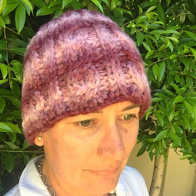 Ravelry: Loom Knit Cabled Beanie pattern by Faith Schmidt