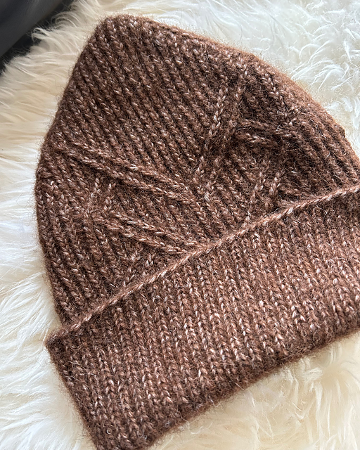 Ravelry: Twist and Tangle Hat pattern by Barbara Seidenfaden