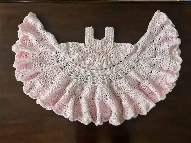 Ravelry: Lace and Ruffles Baby Dress pattern by Emily Spitzer