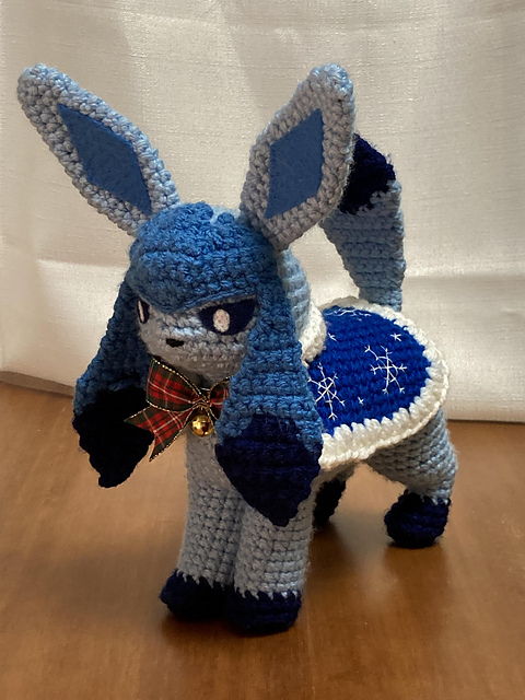 Ravelry: Glaceon (Holiday Cape) pattern by Commonplace Crafts