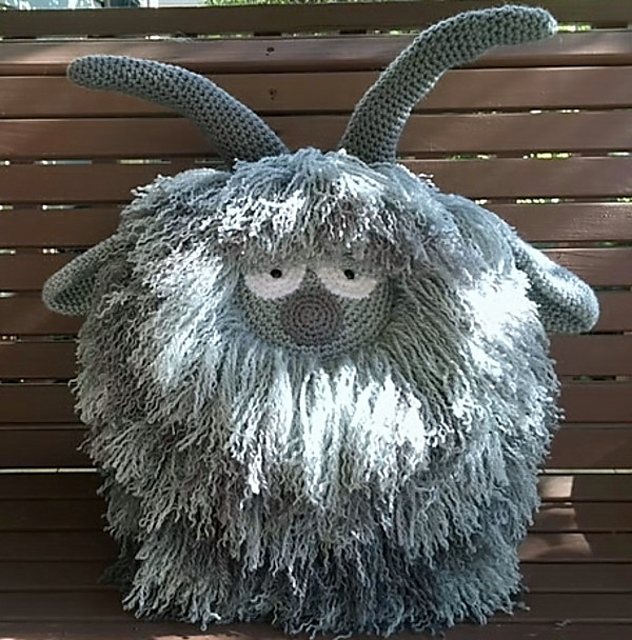 Ravelry: Grey Goat Pillow pattern by Care Sharpin