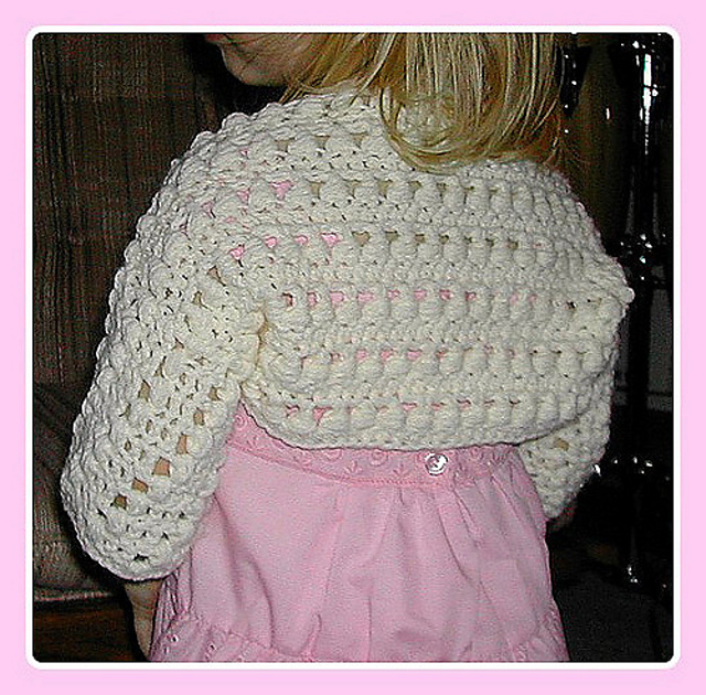 Ravelry: Girl's Shrug (Sizes 5-12) pattern by Andrea Moberly