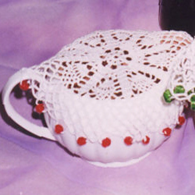 Ravelry: Cate's pineapple lace beaded creamer cover. pattern by ...