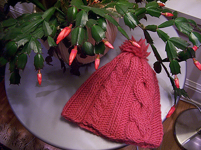Ravelry: Asymmetrical Cable Hat pattern by Leigh Radford