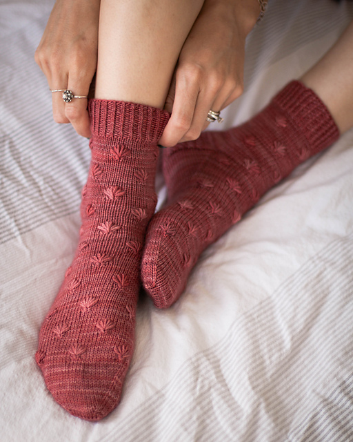 Ravelry: Shell Strand Socks pattern by Dawn Hamblin