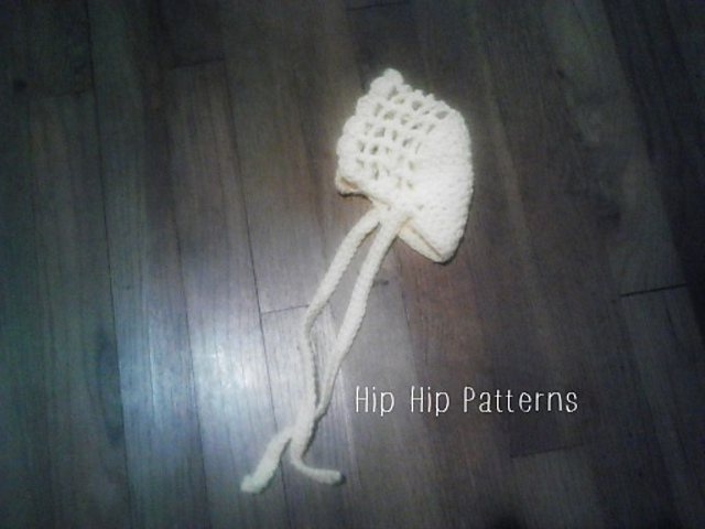 Ravelry: Newborn or Doll Bonnet pattern by Andrea Collins