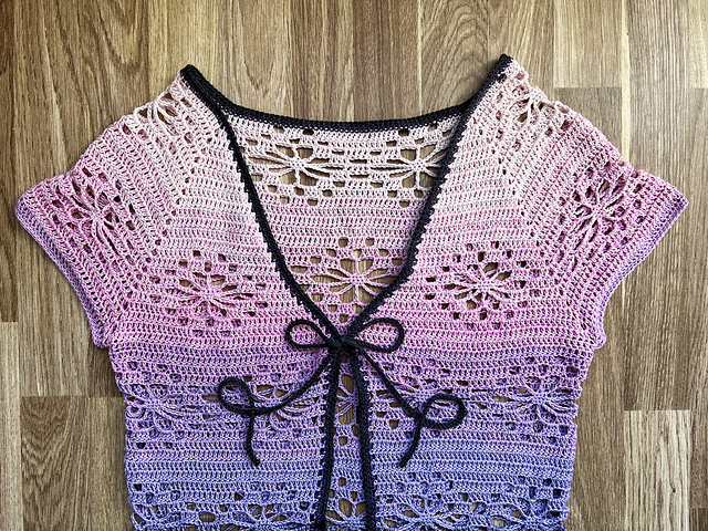 Ravelry: Floral Short-Sleeved Cardigan pattern by Island Magic (Indra)