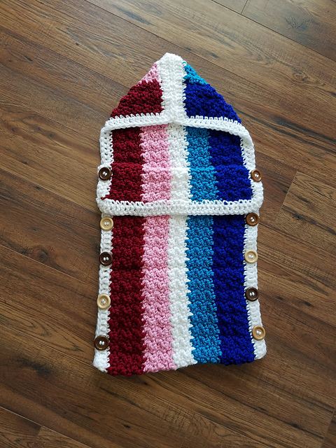 Ravelry: "Cozy" Textured Baby Cocoon pattern by Janene Eldred