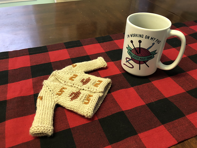 Ravelry: Mini Vintage Curling Sweater pattern by Julia Reichelt