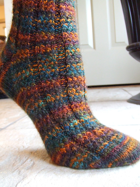 Ravelry: Fascine Braid Socks pattern by Caryll Bilbao