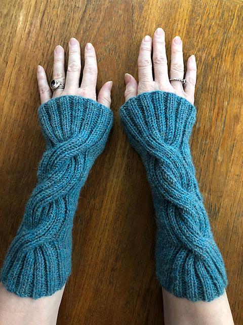 Ravelry: Swirling Cable Gauntlets pattern by Lady Violette de Courcy