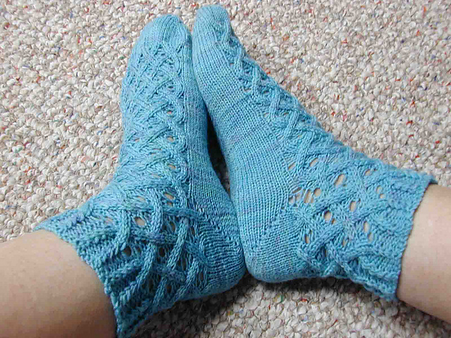 Ravelry: Woven Cable Eyelet Socks pattern by Bridget Landry