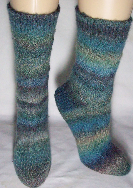 Ravelry: Cascading Water Socks pattern by oftroy