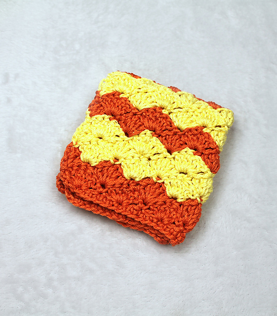 Ravelry: Striped Shell Dishcloth pattern by Heather Hamlin