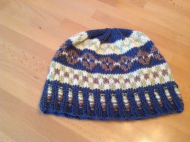 Ravelry: Fair Isle Cross Hat pattern by Suzanne Reyes