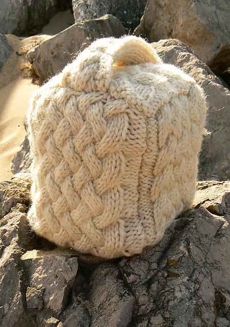 Ravelry: Knitted Aran Cabled Door Stop pattern by Jay Ingram-Seal