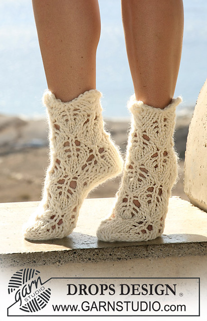 Ravelry: 106-33 Socks with lace pattern pattern by DROPS design