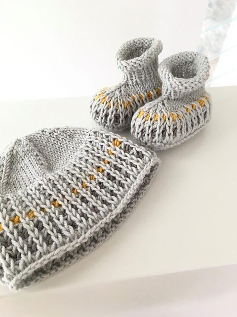 Ravelry: Nesting Booties and Hat pattern by Sharyn Armstrong