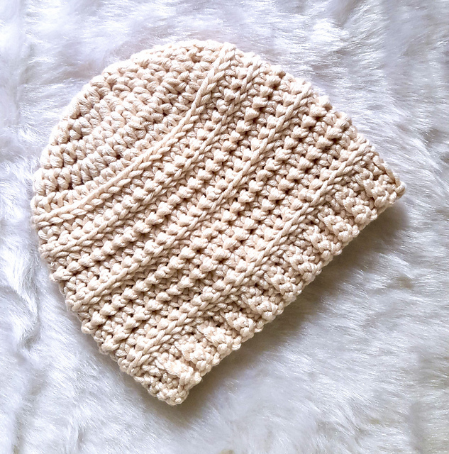 Ravelry: Dotty and Braidy Hat pattern by Kavita Goel